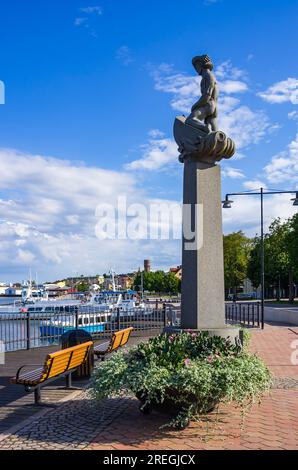 Maritime scene and sculpture Scouting Sailor in the city harbour of ...