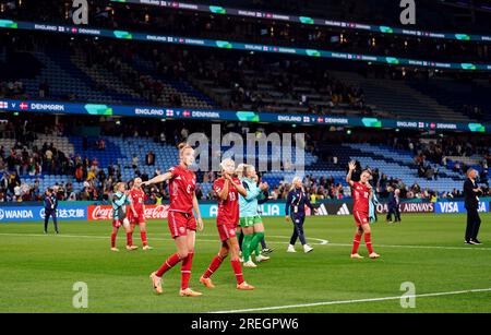 Denmark's Pernille Harder (centre) and Karen Holmgaard following the ...
