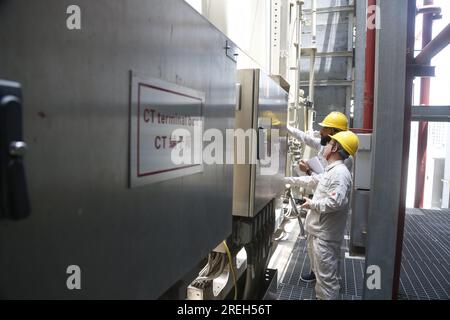 Lahore, Pakistan. 4th July, 2023. Zubair Tufail (R) works in the ...