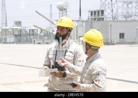Lahore, Pakistan. 4th July, 2023. Zubair Tufail (R) works in the ...