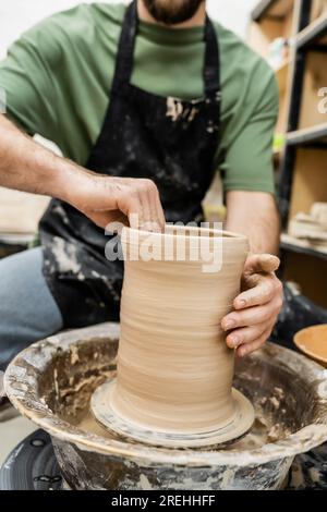 partial view man shaping clay into cup in pottery workshop,stock image ...