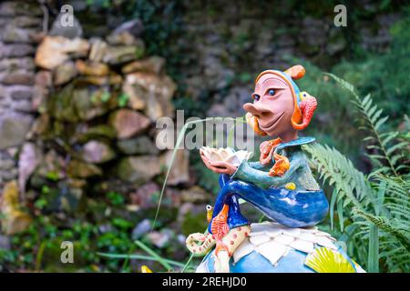 Colorfully painted ceramic elf in the Elf Yard. Valley of Arts Festival ...