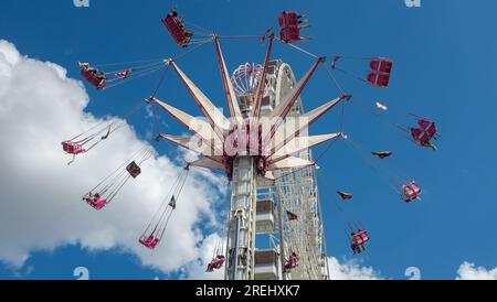 Paris carousel - Chair swing ride in amusement park at Tuileries garden ...