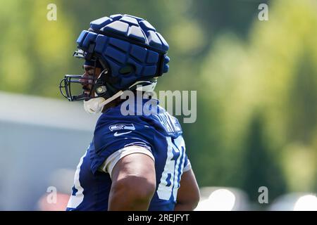 Seattle Seahawks guard Phil Haynes (60) spikes the ball during an NFL ...