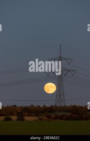 Moon with lattice mast Overhead line Stock Photo - Alamy