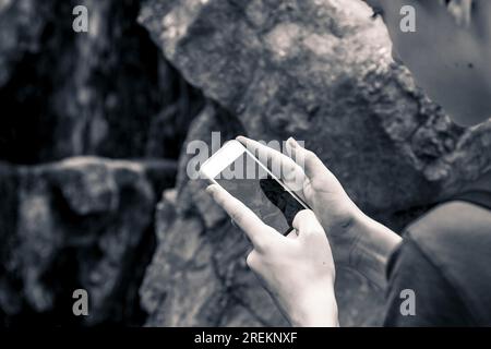 two hands holding a filming smart phone Stock Photo - Alamy