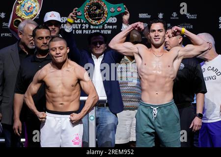 Isaac Cruz, left, and Giovanni Cabrera fight during their lightweight ...