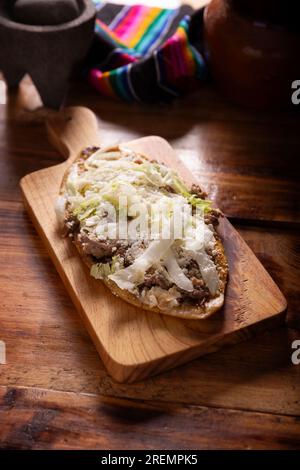 huarache mexican food dish. with sauce, meat and avocado Stock Photo ...