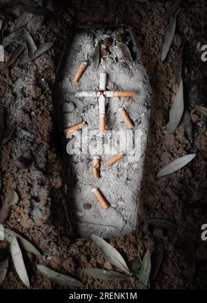 Image representing Cigarettes and Death. Shape coffin on the ground ...