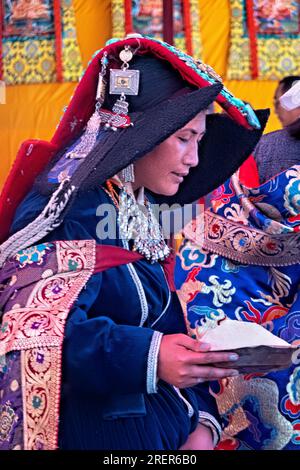 Ladakhi woman in traditional clothing at a high lama teaching, Lingshed ...