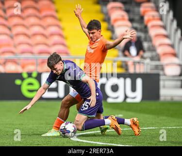 Rob Apter #36 of Blackpool battles with Owen Hastie #45 of Hibernian ...