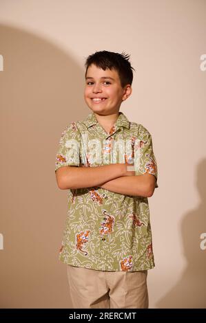 Adorable hispanic boy smiling confident standing by chalkboard with ...