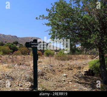 Signpost for the path to Lethra beach along the rocky mountain path ...