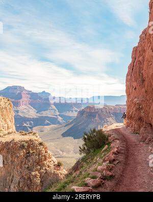 Rugged canyon landscape with a winding trail and clear blue sky. USA ...