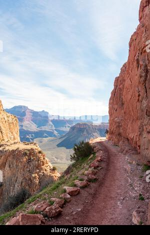 Rugged canyon landscape with a winding trail and clear blue sky. USA ...