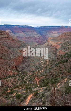 Rugged canyon landscape with a winding trail and clear blue sky. USA ...