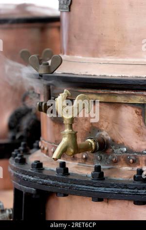 Close-up of alcohol distillation and brandy production with copper ...