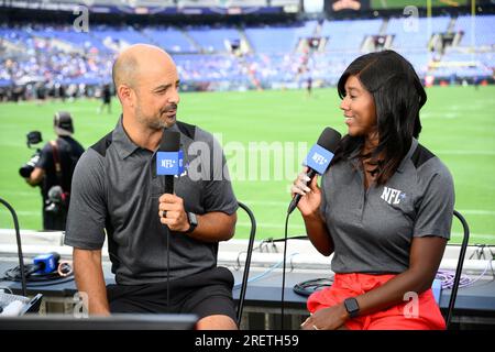 NFL Network reporters Mike Garafolo, left, and Sherree Burruss, right, report from Baltimore ...