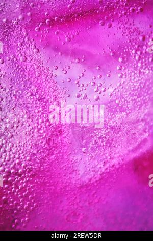 Ice with lilac colored tonic Stock Photo - Alamy