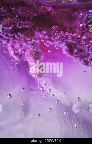 Ice with lilac colored tonic Stock Photo - Alamy