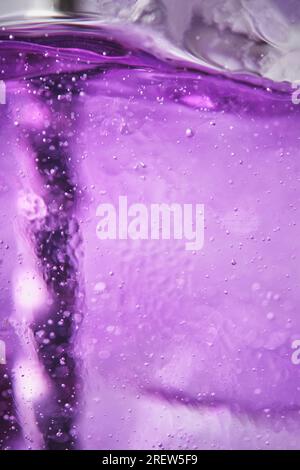 Ice with lilac colored tonic Stock Photo - Alamy