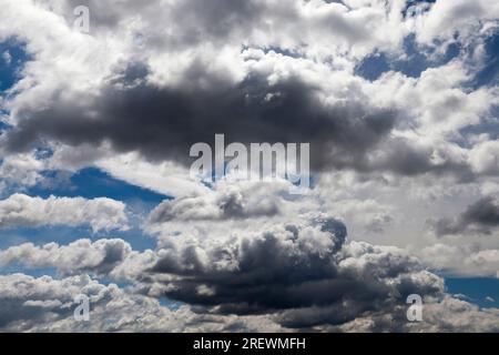 a real blue sky with lots of clouds in the sunny time of the day ...