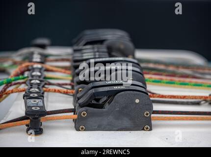 multi-coloured sailing ropes running through rope clutches. rope ...