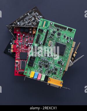 Collection of colourful internal sound cards. Neutral background. PC ...