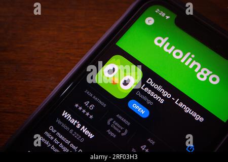Duolingo app seen in App Store on iPhone. Duolingo is an US educational ...