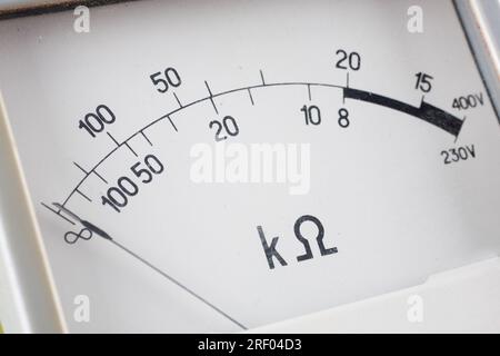 Close-up of an vintage ancient ohmmeter isolated on white background ...
