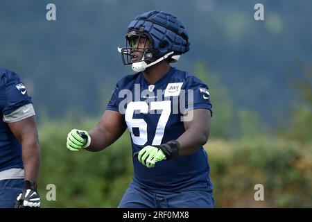 Seattle Seahawks offensive tackle Charles Cross (67) lines up with ...