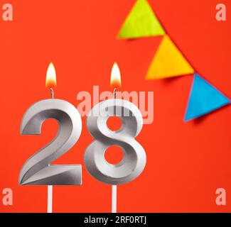 Birthday card with number 28 candle on aquamarine background Stock ...