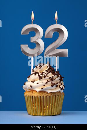 Lit birthday candle - Candle number 32 on white background Stock Photo ...