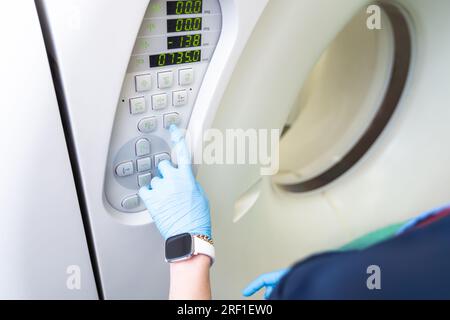 hand of doctor operating Computed Tomography device Stock Photo - Alamy