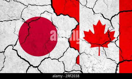 Flags of Canada and Japan on cracked surface - politics, relationship ...