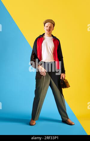 Creative collage of two halves of emotional young man in various ...