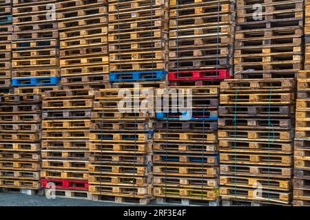 stacks of wooden EPAL pallets on dockyard at Sisimiut, Greenland on a ...