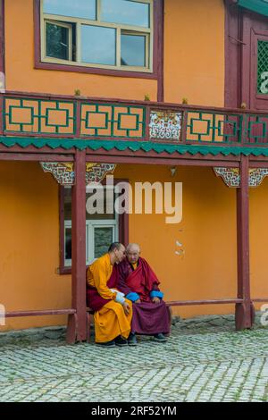 A courtyard scene with a monk at the Gandantegchinlen Monastery in ...