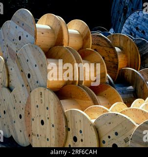 Wooden cable reels, stack, sawmill Stock Photo - Alamy