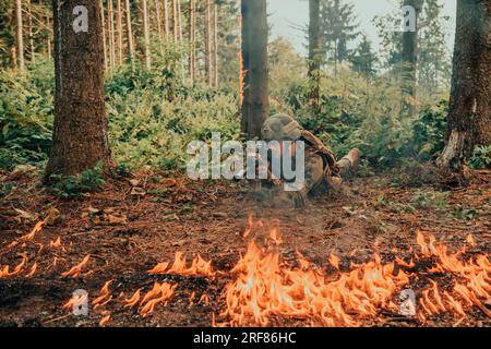 Modern warfare soldier surrounded by fire, fight in dense and dangerous ...