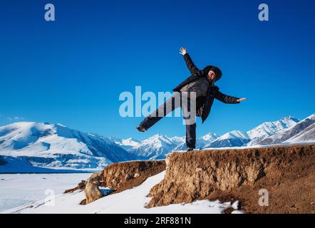 A man balancing rocks on top of one another Stock Photo - Alamy