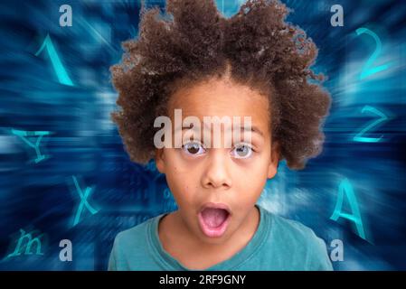 Surprised Shocked preschool boy in front of the blue technology ...