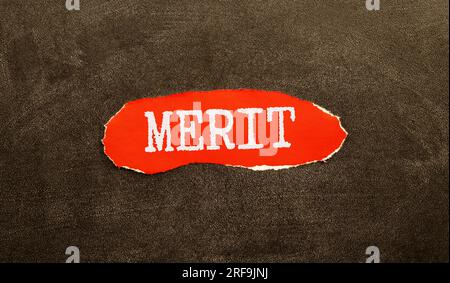 Merit symbol. Wooden cubes with the word 'merit'. Beautiful white ...