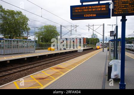A fast through train passing through Stevenage railway station Stock ...