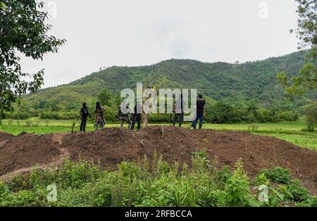Armed youths from the Kuki tribe pose for a photo during their ...