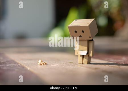 Small wooden toy robot danbo lonely isolated alone sad character, wood ...
