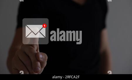 Businessman pressing messaging type of modern icons with virtual ...