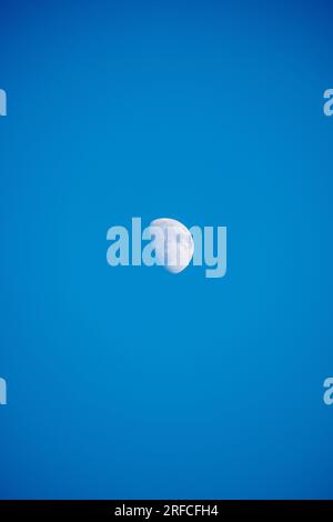 Half moon in daytime sky Stock Photo - Alamy