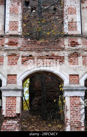 Arched window openings of a destroyed abandoned building. Broken ...