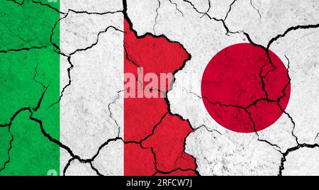 Flags of Japan and Italy on cracked surface - politics, relationship ...